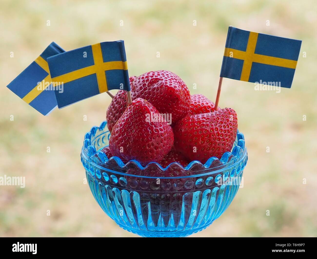 Strawberries with swedish flags for Swedens National Day or Midsummer ...