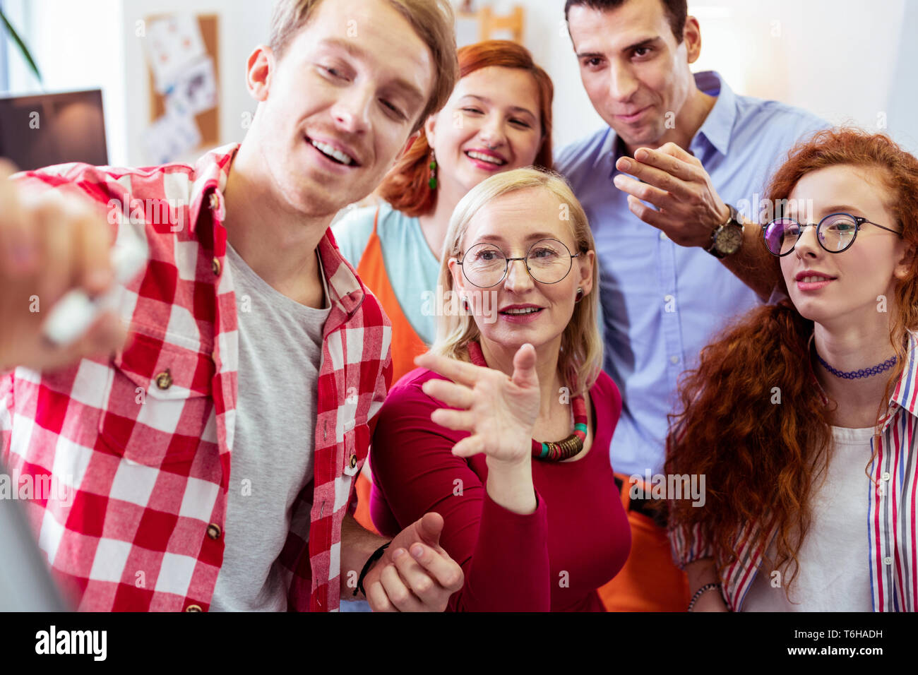 Positive nice people having an engaging discussion Stock Photo - Alamy