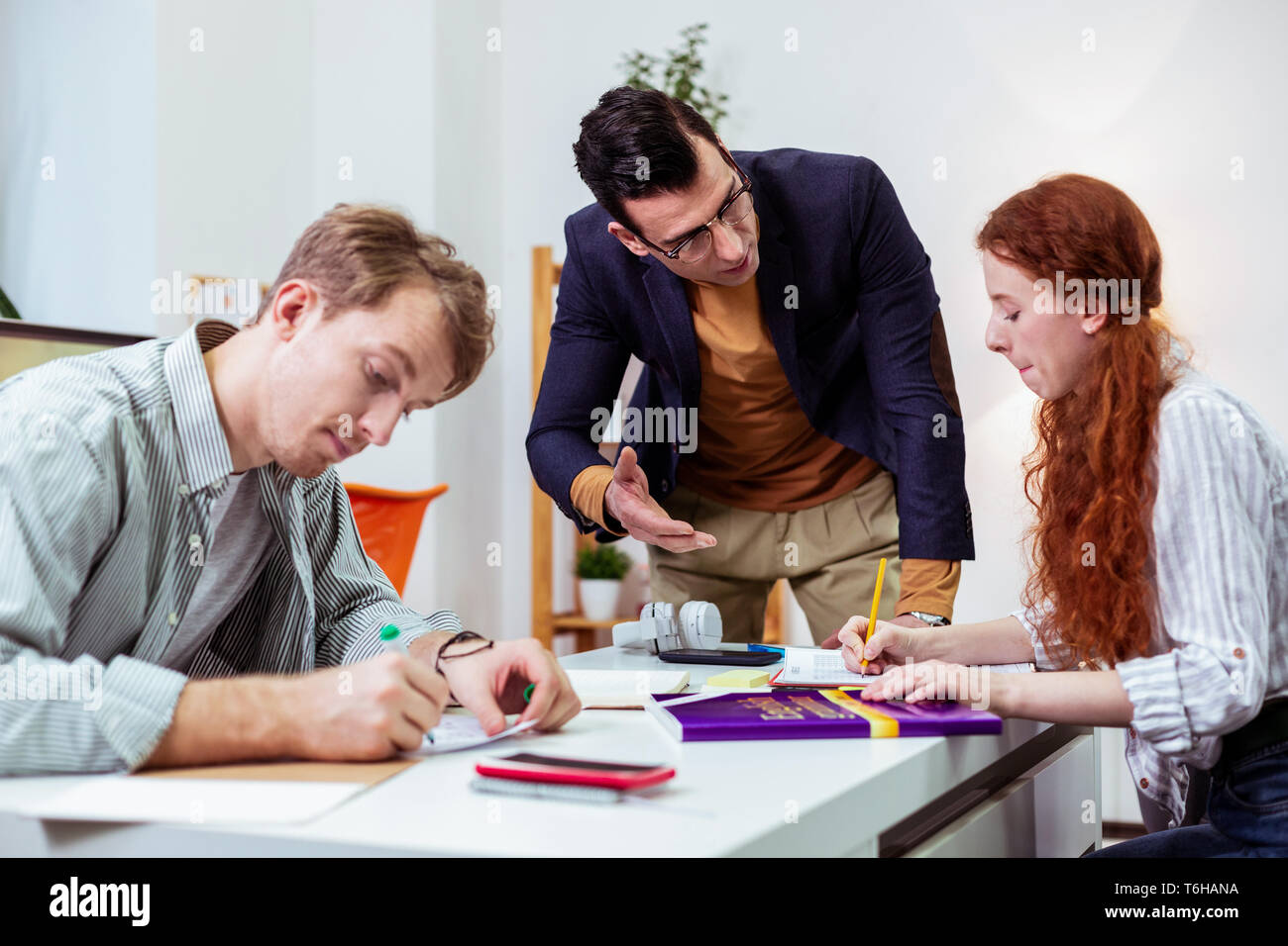 Teacher taking notes classroom hi-res stock photography and images - Alamy