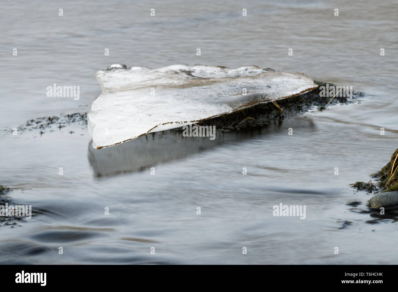 Flowing water with a single ice floe hi-res stock photography and ...