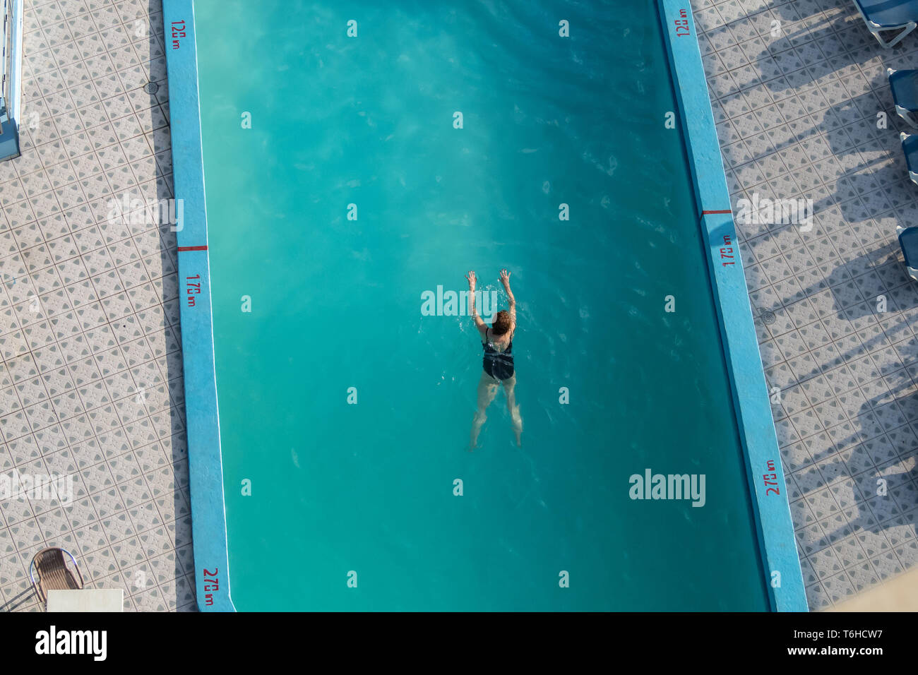 Swimmer in a hotel pool from above Stock Photo - Alamy