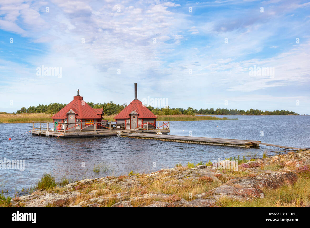Sauna house on a jetty in a lake Stock Photo - Alamy