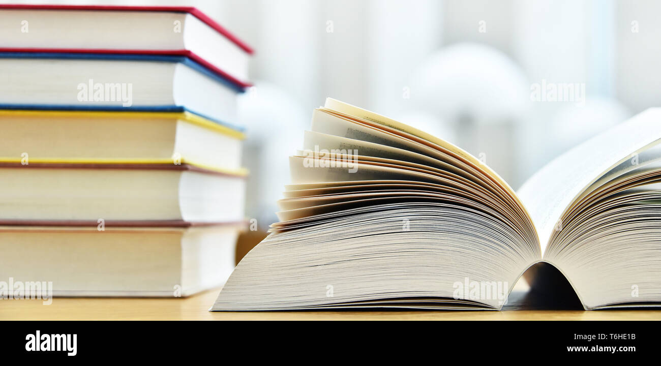 Books lying on the table in the public library Stock Photo - Alamy