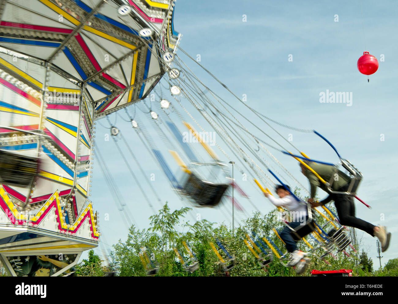 amusement machine in a luna park. swing wheel with high speed rotating ...
