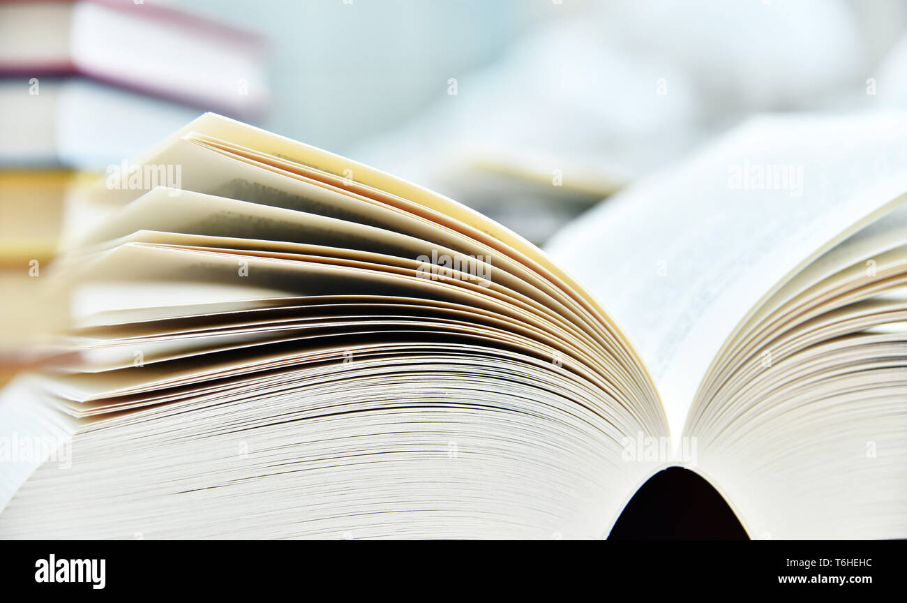 Books lying on the table in the public library Stock Photo - Alamy