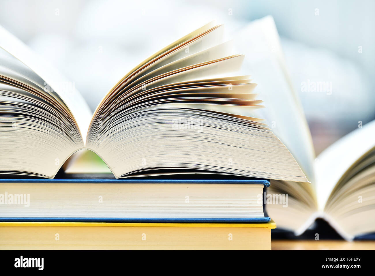 Books lying on the table in the public library Stock Photo - Alamy