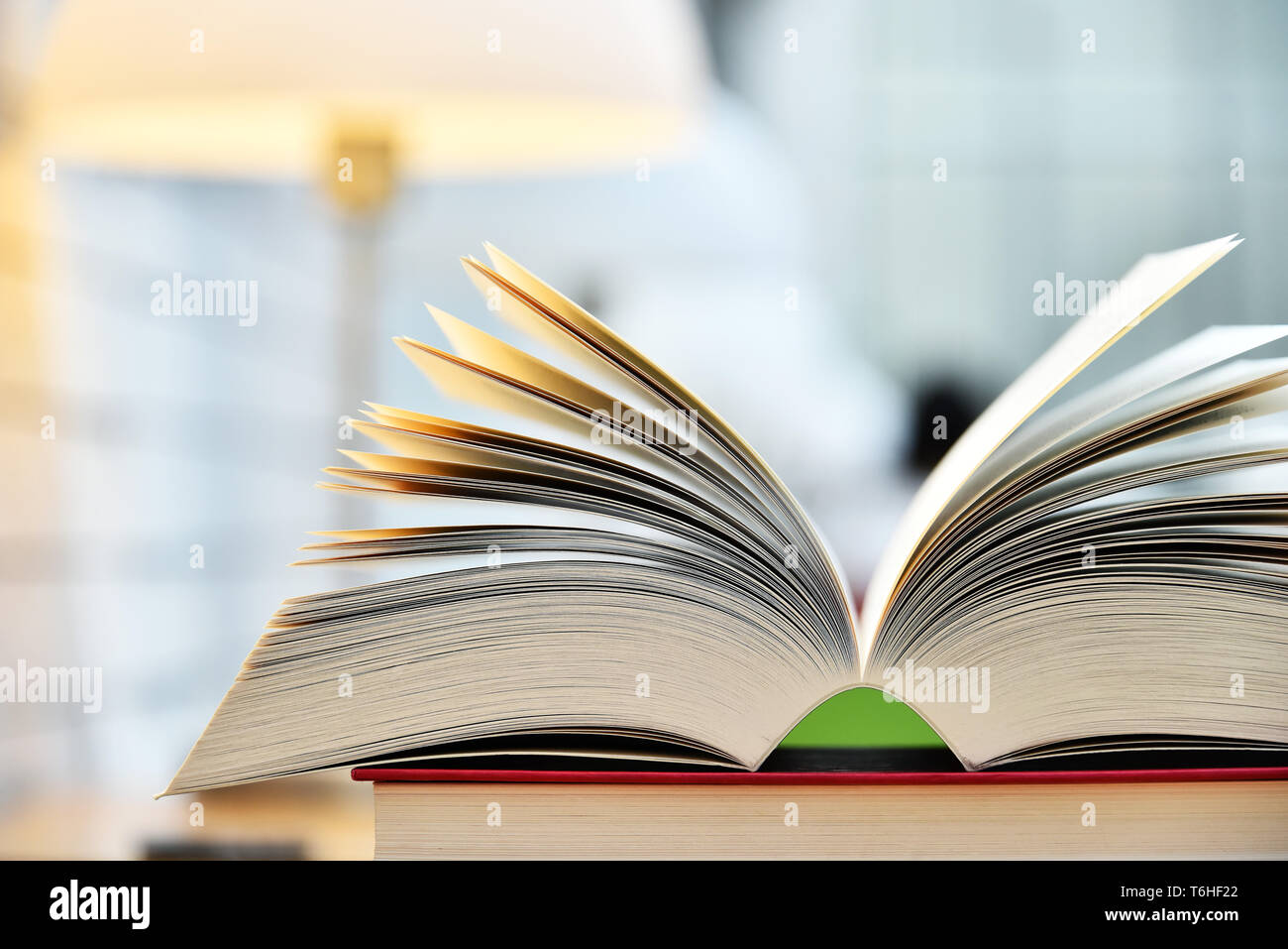Books lying on the table in the public library Stock Photo - Alamy