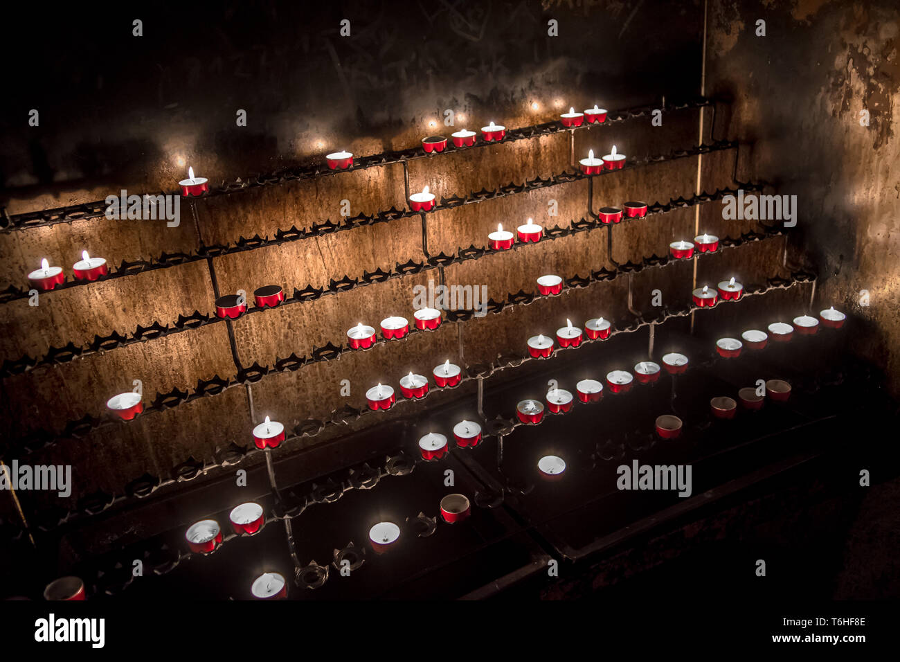 Red Memory Candles Burning In Chapel Stock Photo - Alamy