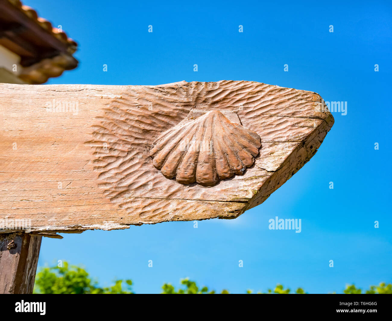Traditional shell sign on the way. Direction sign for pilgrims in Saint ...
