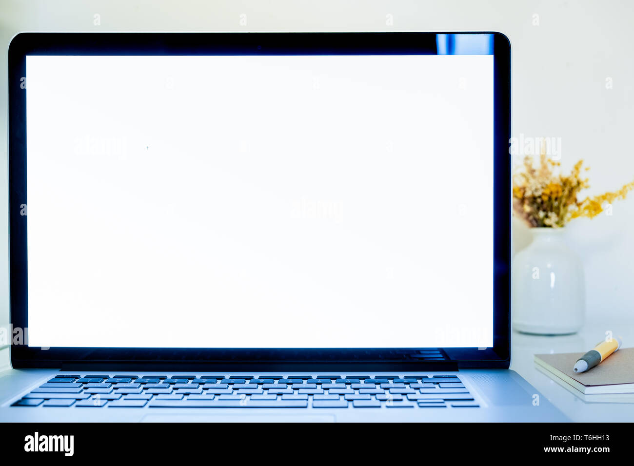 White screen of a laptop, close-up copy space view. Portable computer ...