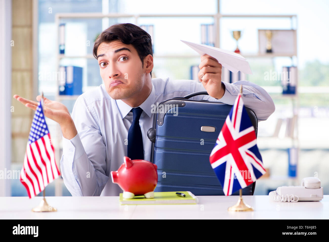 Sales agent working in travel agency Stock Photo - Alamy