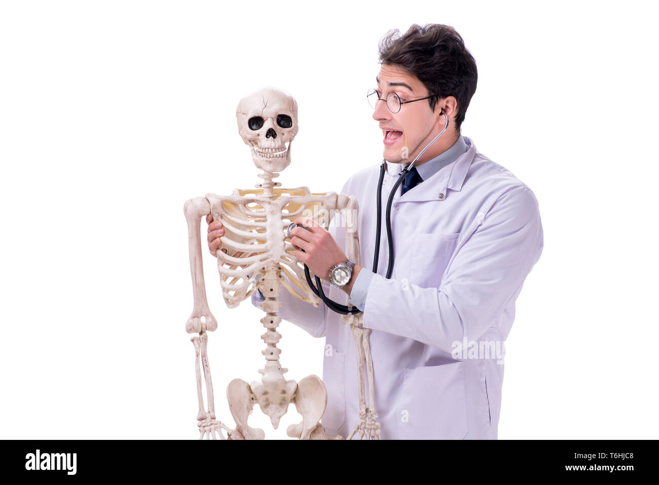 Young doctor with skeleton isolated on white Stock Photo - Alamy