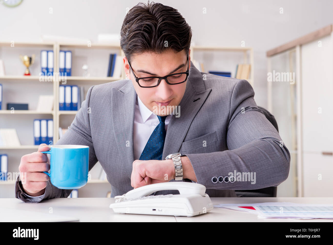 Businessman expecting important call on phone Stock Photo - Alamy
