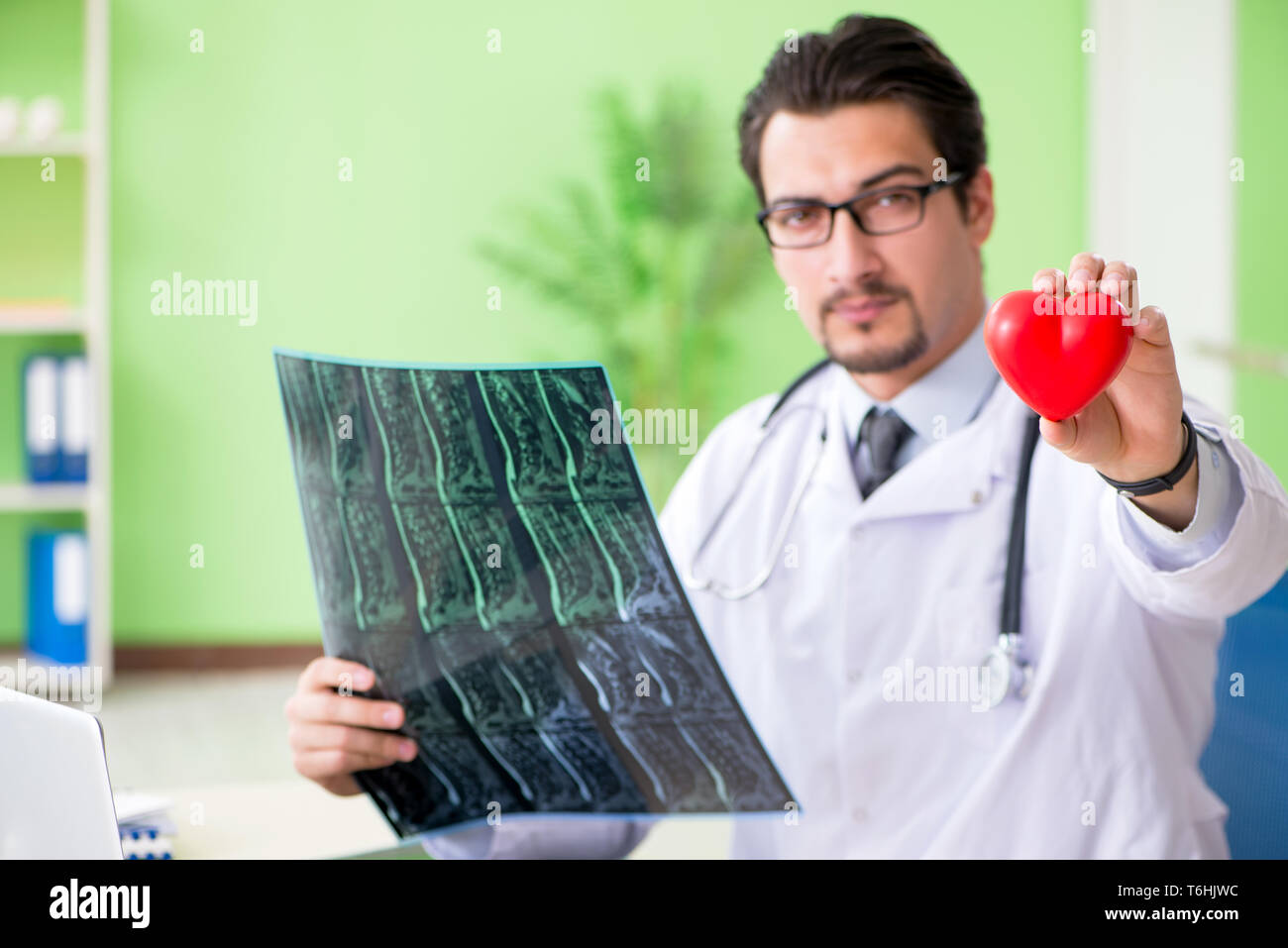 Doctor radiologist looking at x-ray scan in hospital Stock Photo - Alamy