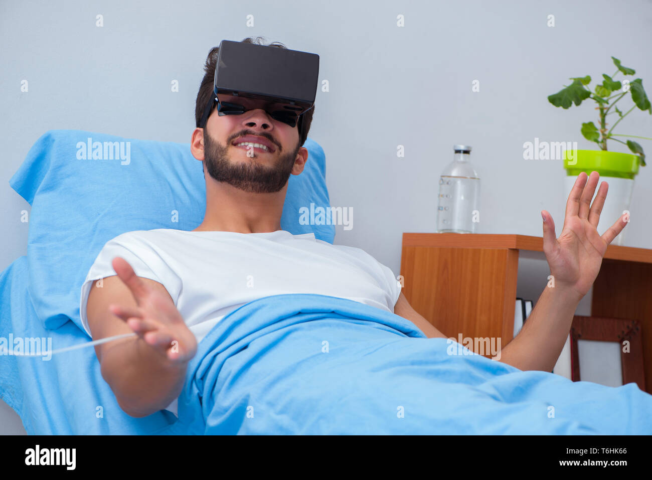 Patient in the hospital with VR glasses headset Stock Photo - Alamy