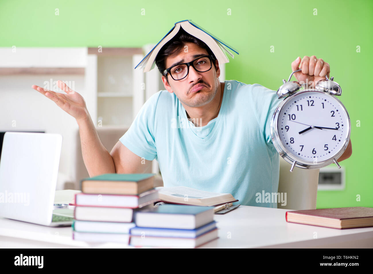 Student preparing for university exams at home in time managemen Stock ...