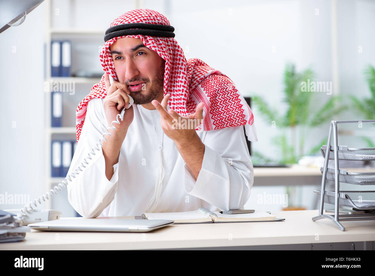 Arab businessman working in the office Stock Photo - Alamy