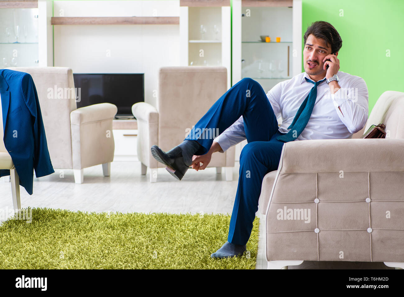 Man dressing up and late for work Stock Photo - Alamy
