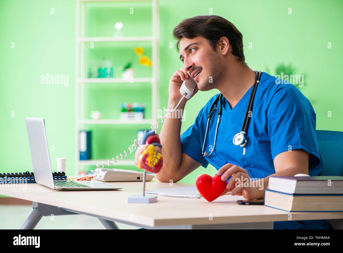 Doctor student explaining heart problems Stock Photo - Alamy