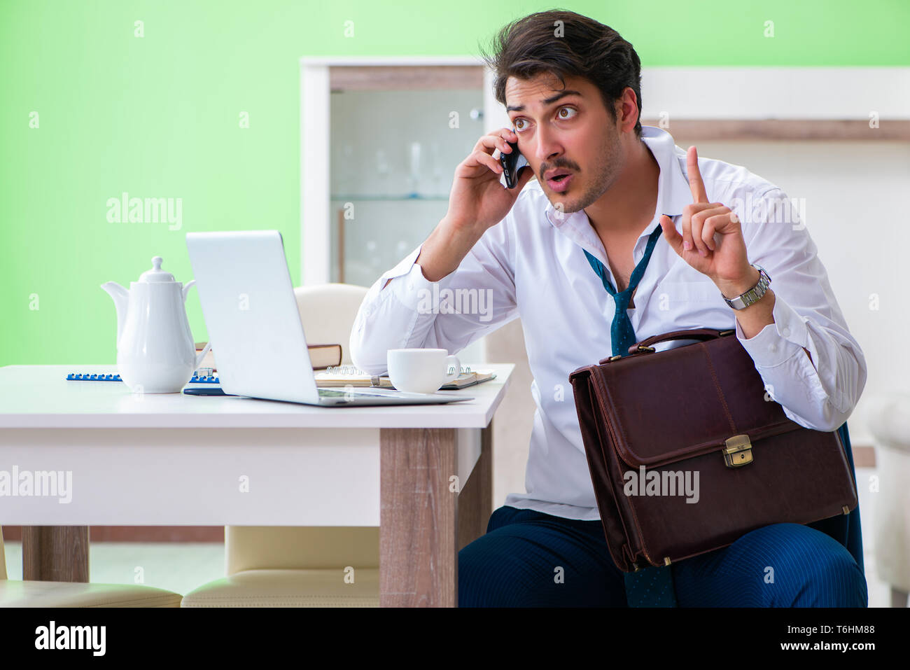 Man dressing up and late for work Stock Photo - Alamy
