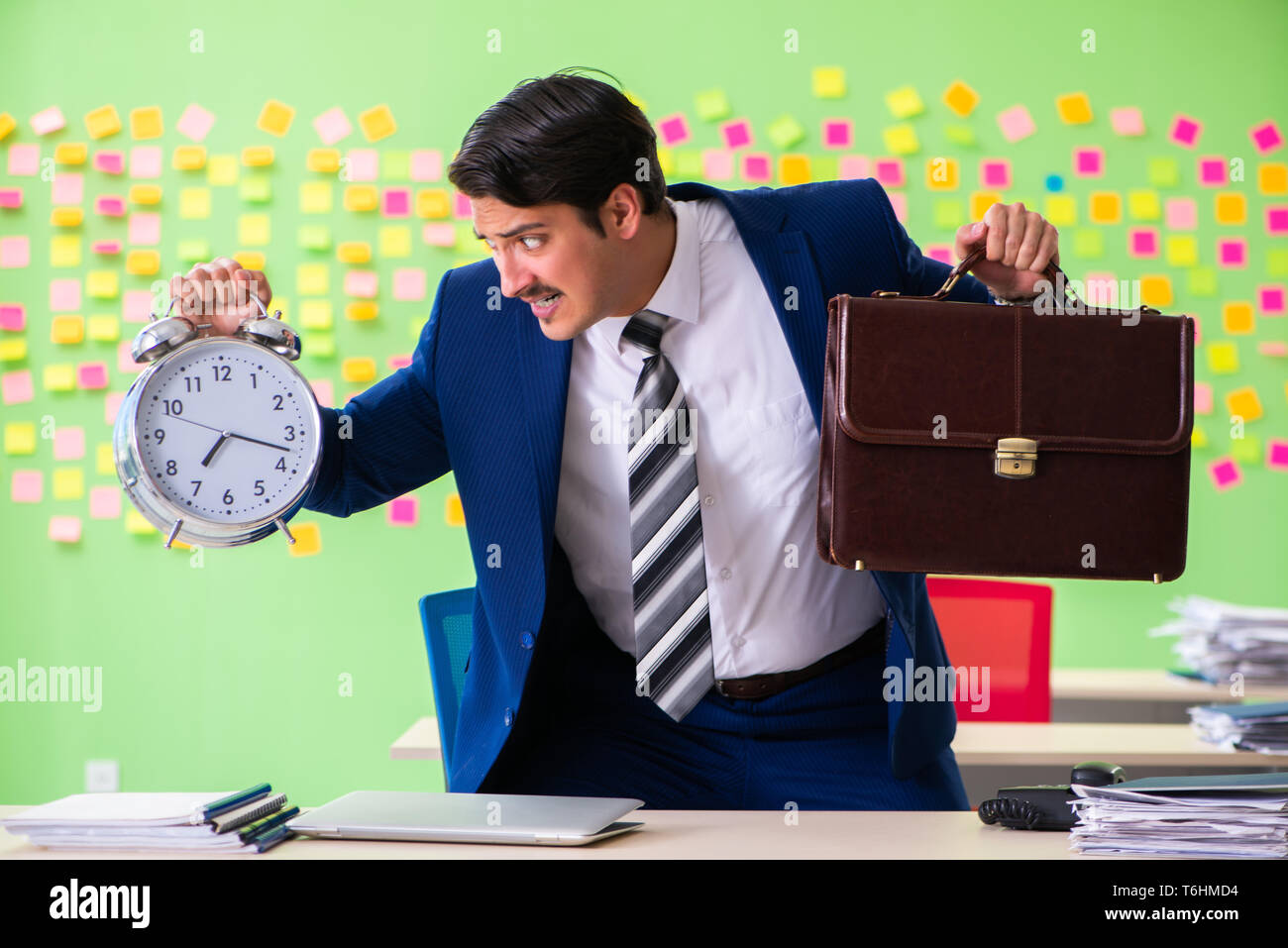 Businessman with many conflicting priorities in time management Stock ...