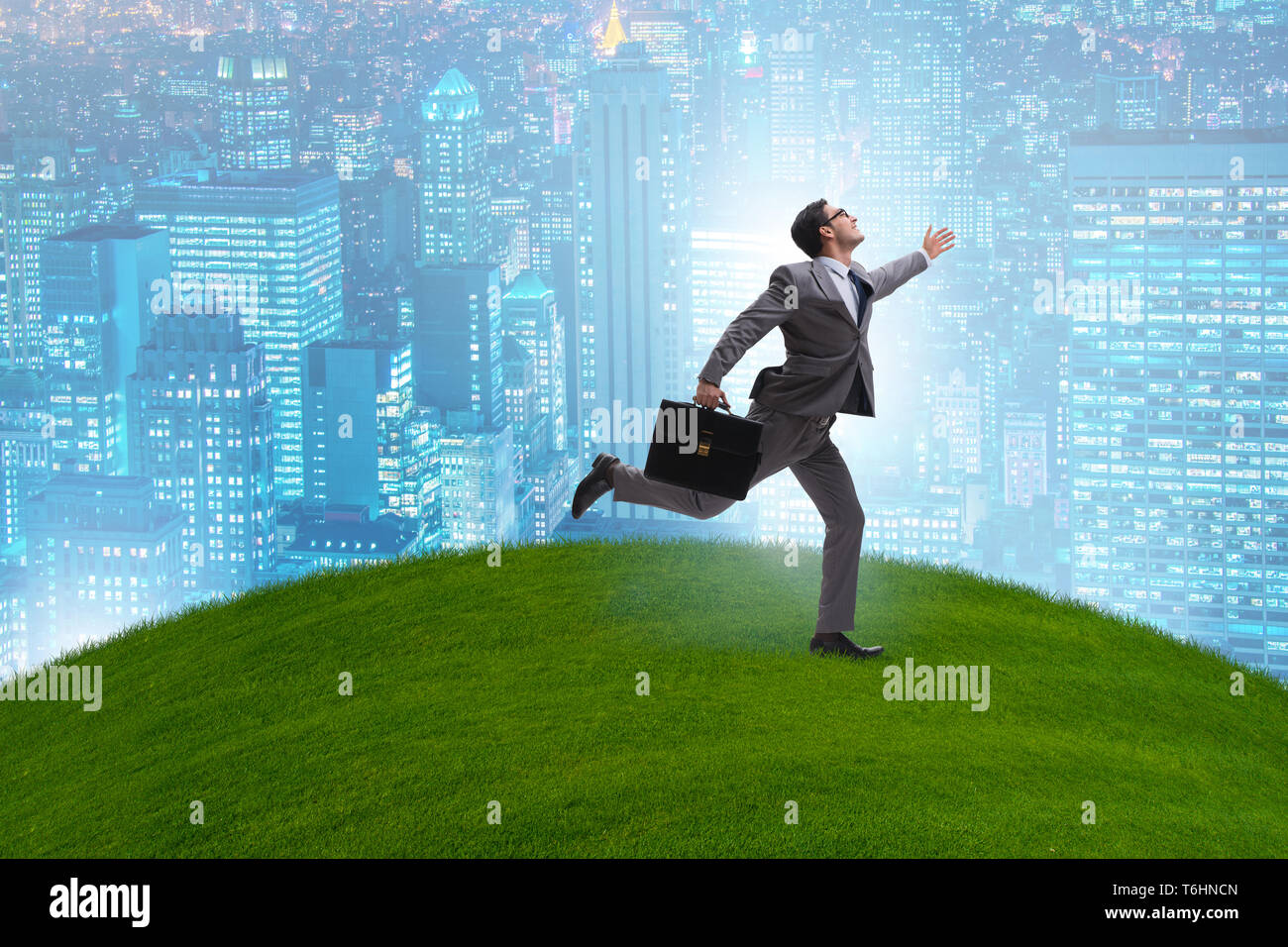 Happy businessman running towards his goal Stock Photo - Alamy