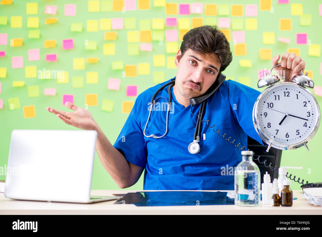 Young doctor with many reminders and urgent work Stock Photo - Alamy