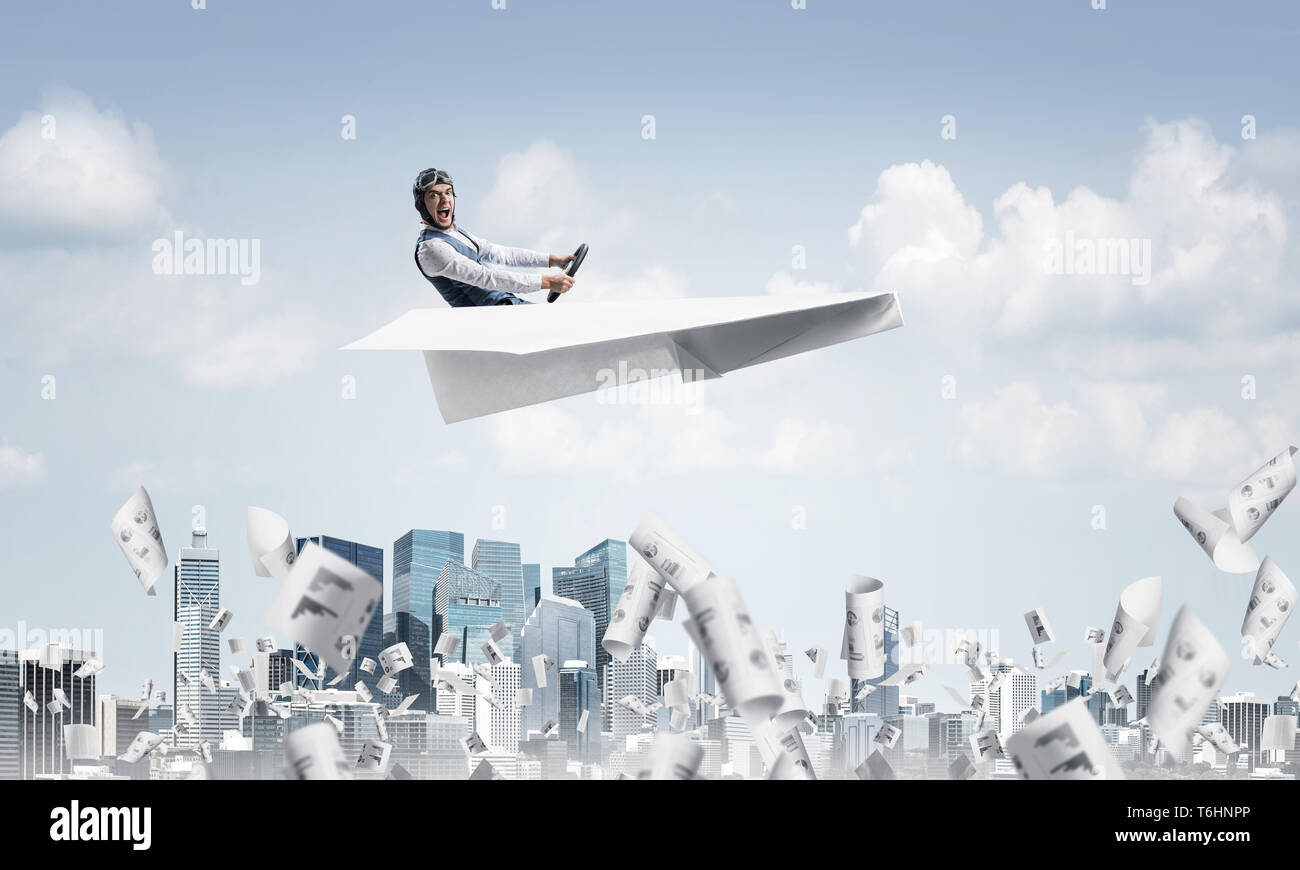 Screaming pilot sitting in paper plane Stock Photo - Alamy