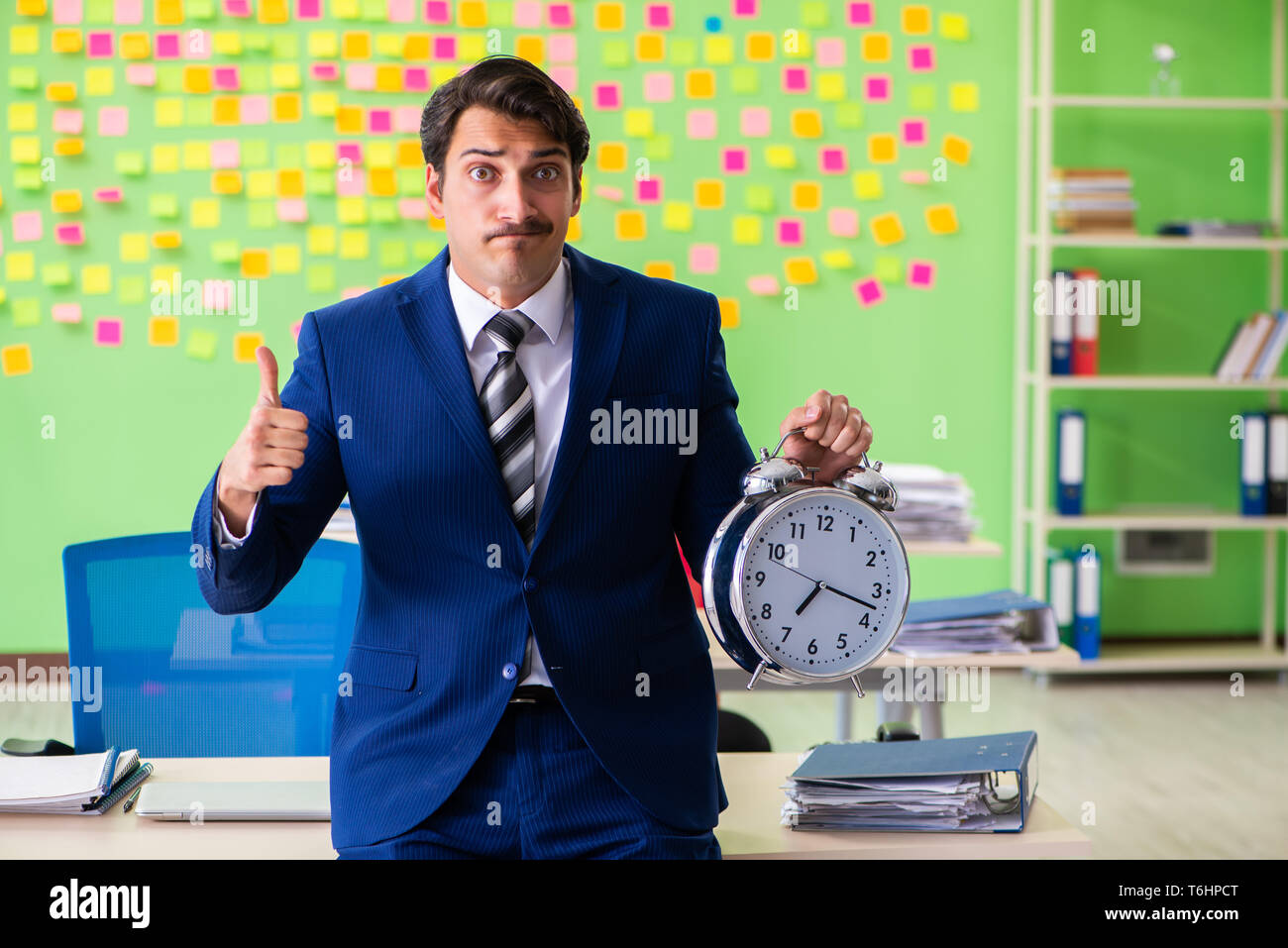 Businessman with many conflicting priorities in time management Stock ...