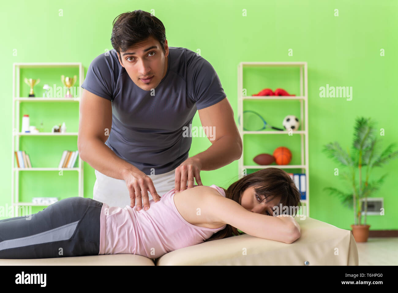 Young doctor chiropractor massaging patient Stock Photo - Alamy