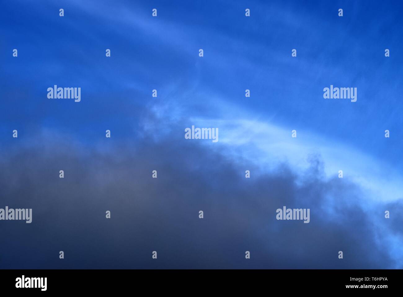 Beautiful mixed cloud formation with white and grey cumulus clouds in ...