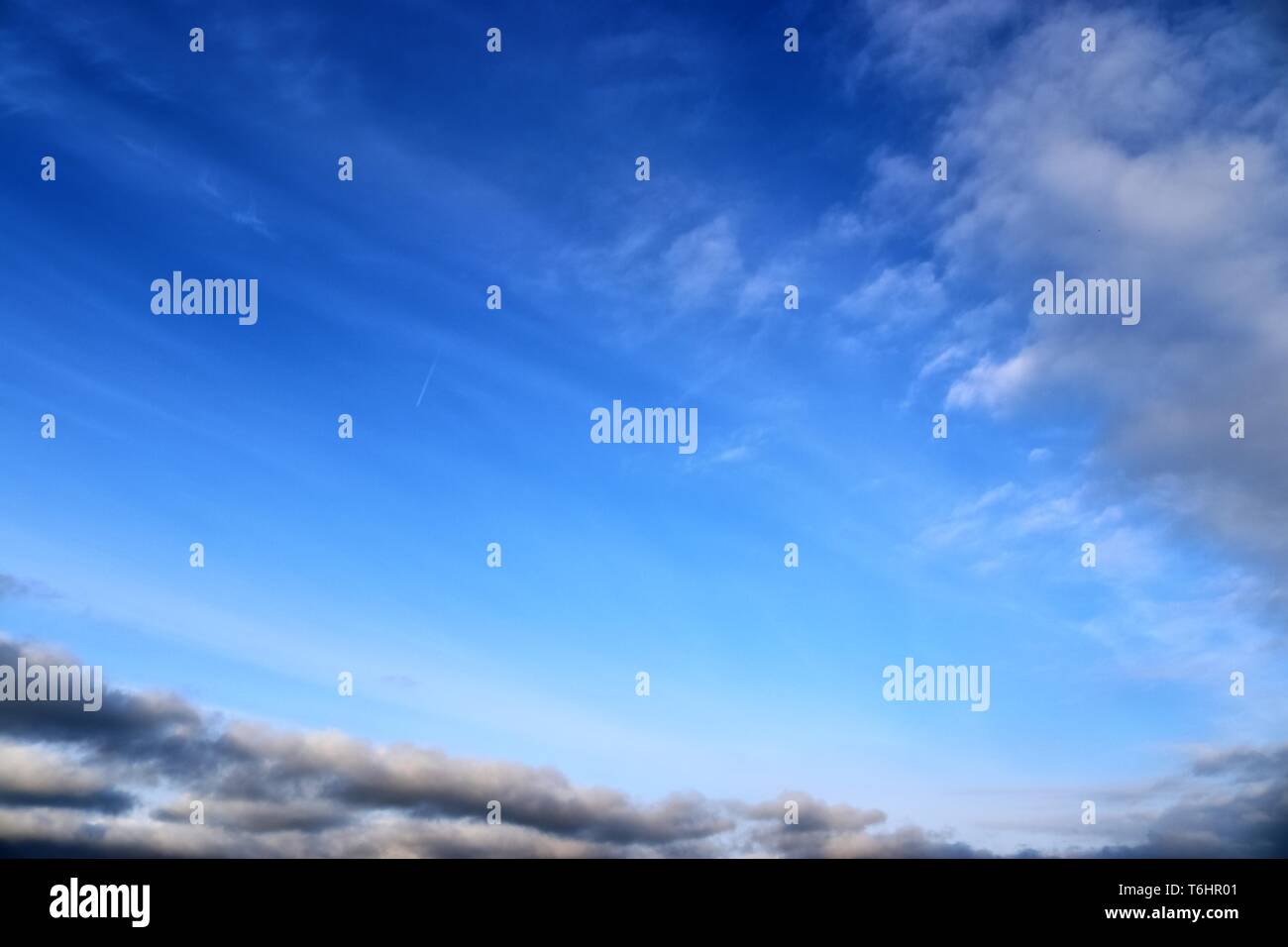 Beautiful mixed cloud formation with white and grey cumulus clouds in ...