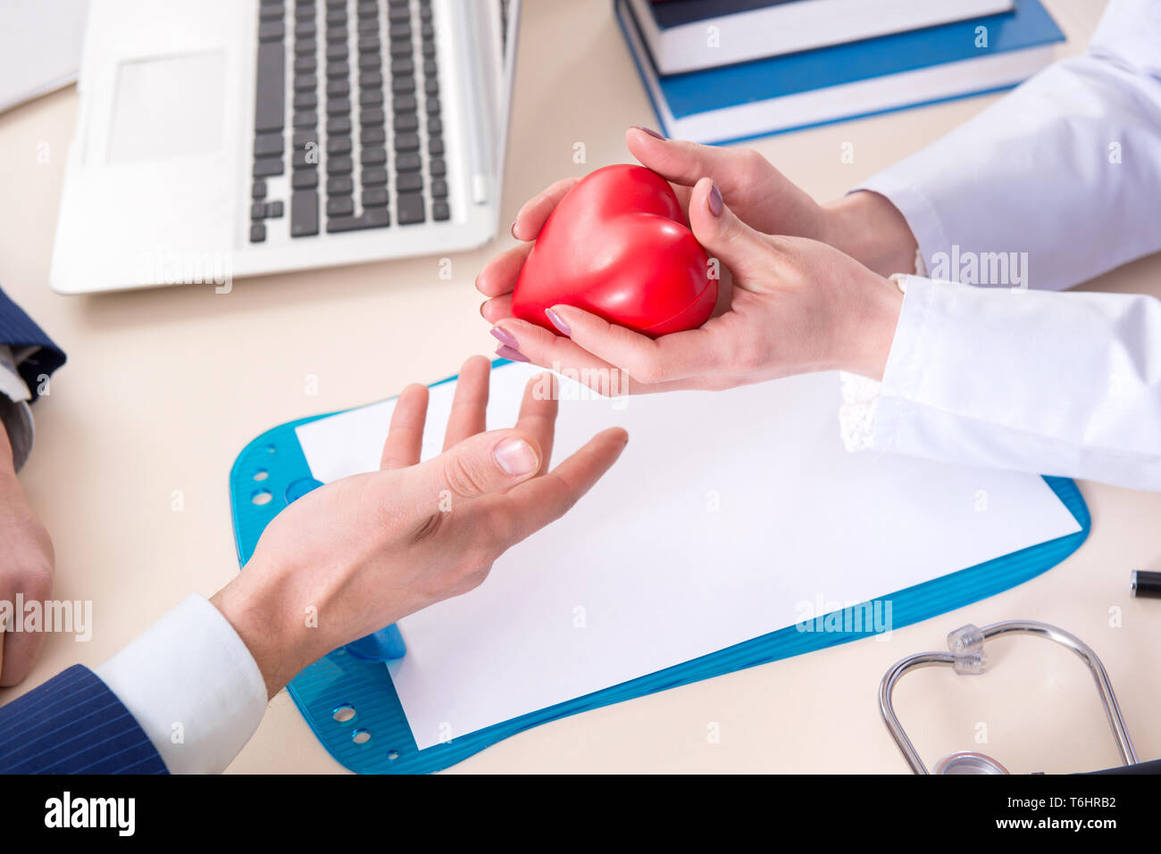 Businessman visiting cardiologist for routine check-up Stock Photo - Alamy