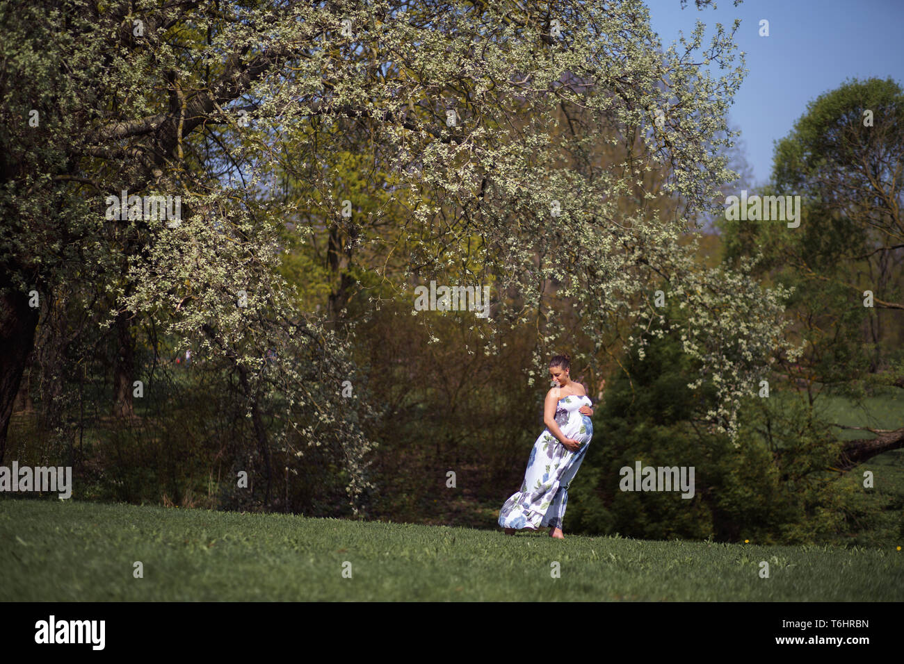 Young traveler pregnant woman walking, running, turning around and ...