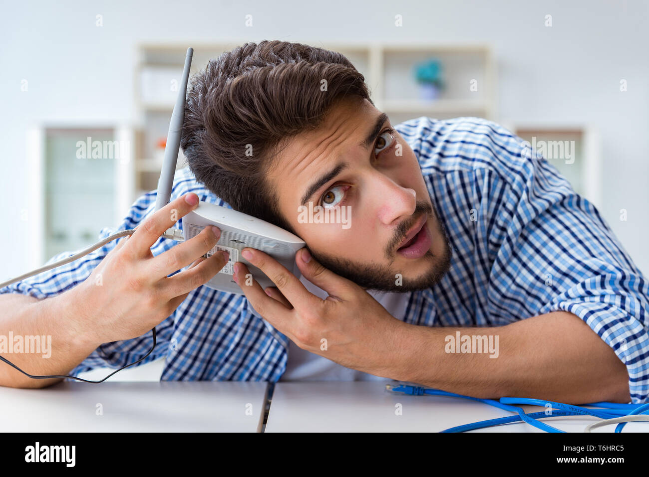 Frustrated young man due to weak internet reception Stock Photo - Alamy