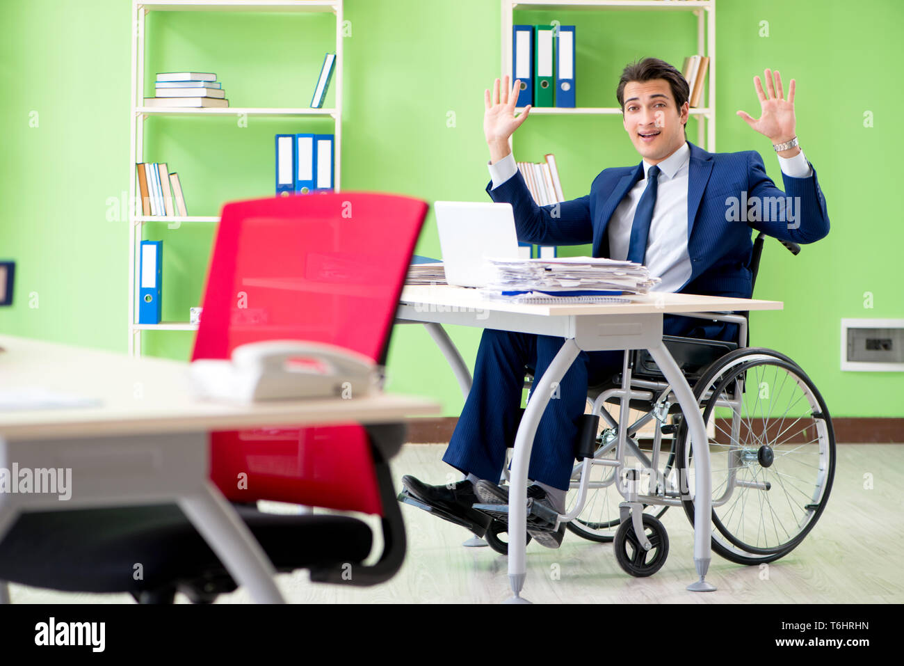 Disabled businessman working in the office Stock Photo - Alamy