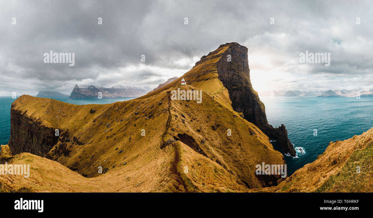 Panoramic view of Kallur lighthouse on Kalsoy island during moody ...