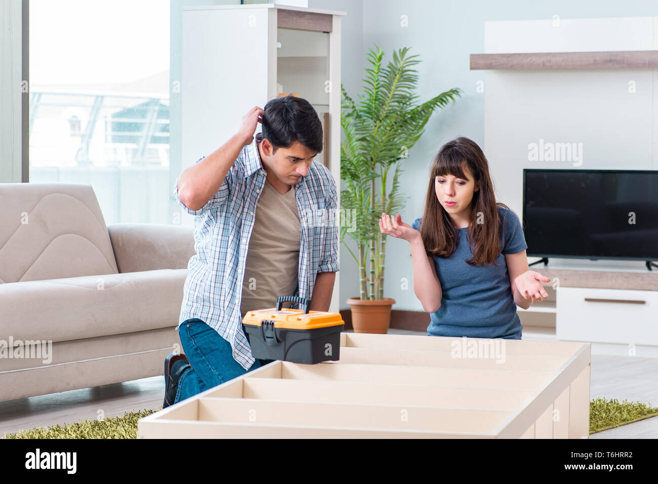 Woman assembling kitchen cupboard hi-res stock photography and images ...