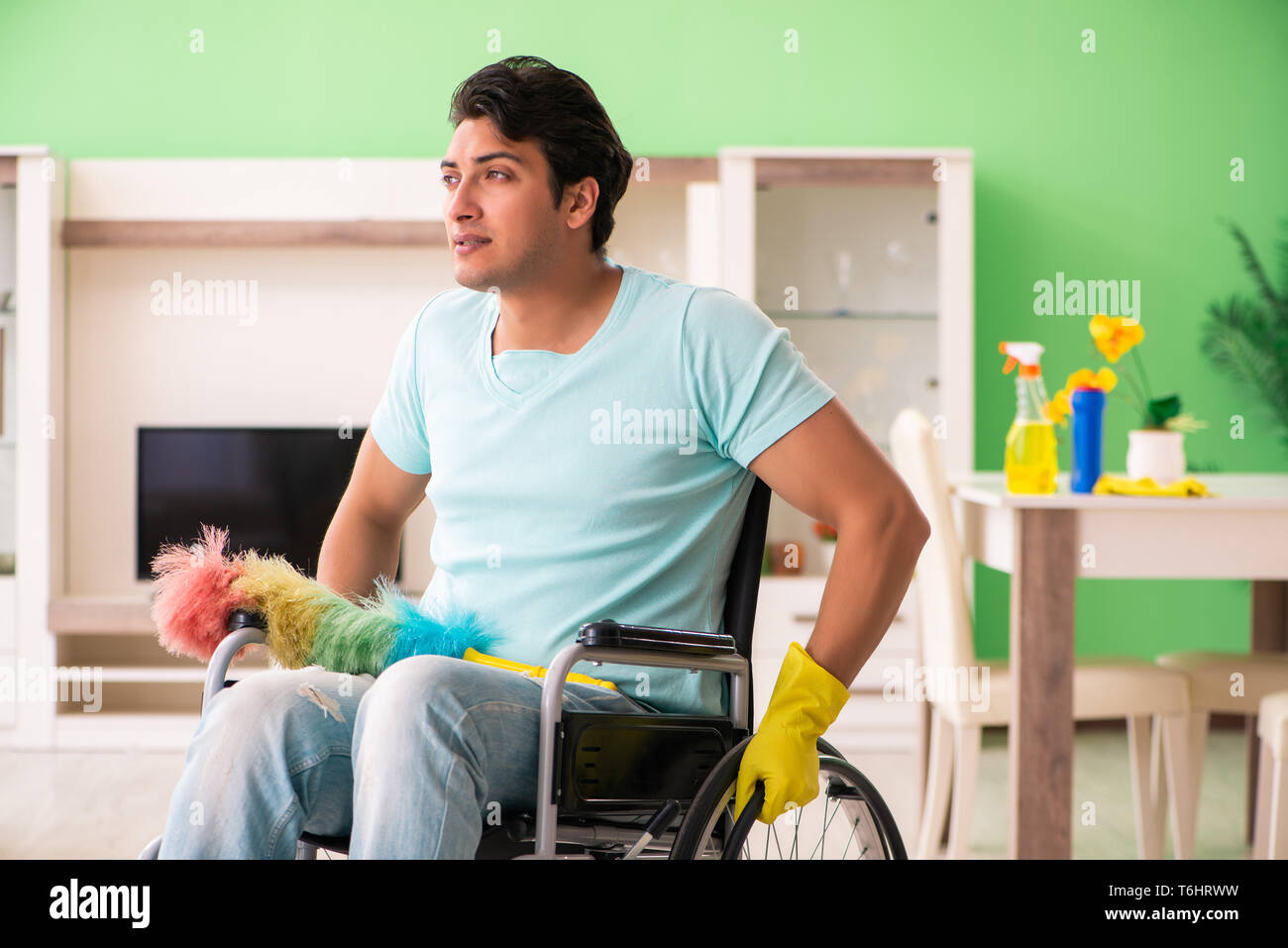 Disabled man on wheelchair cleaning hi-res stock photography and images ...