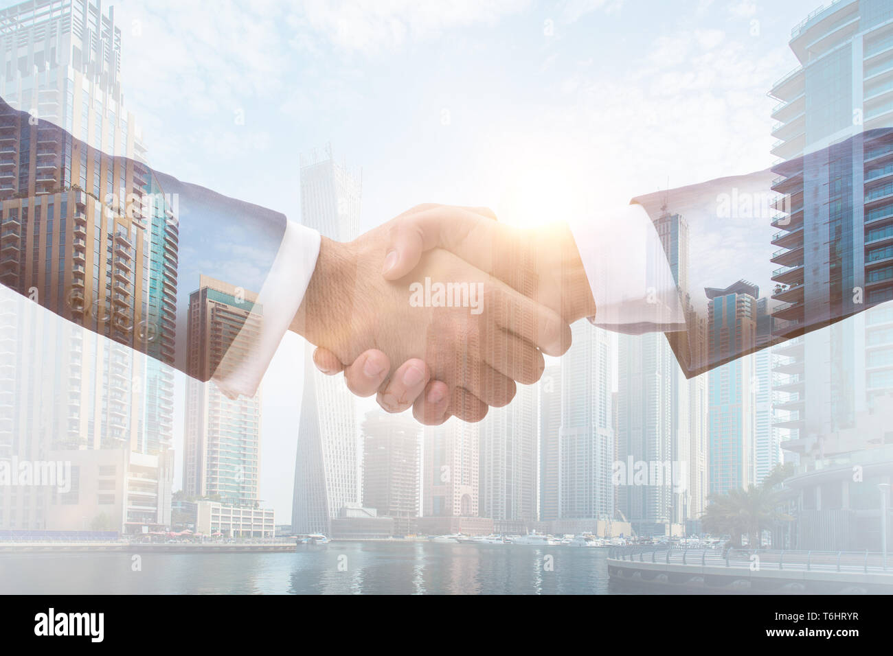 Concept of cooperation with handshake Stock Photo - Alamy