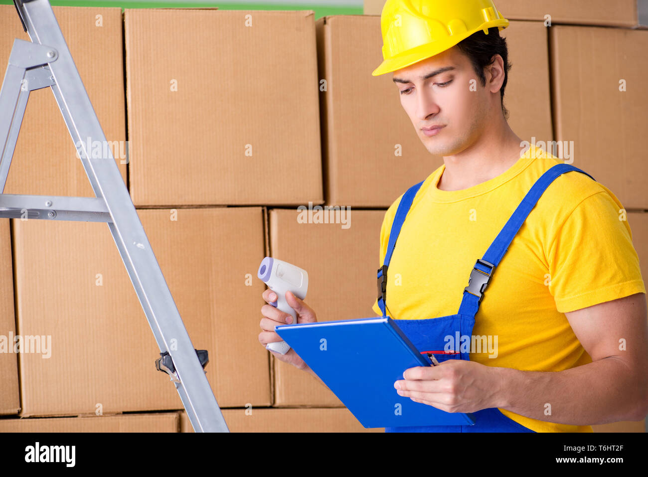 Man contractor working with boxes delivery Stock Photo - Alamy