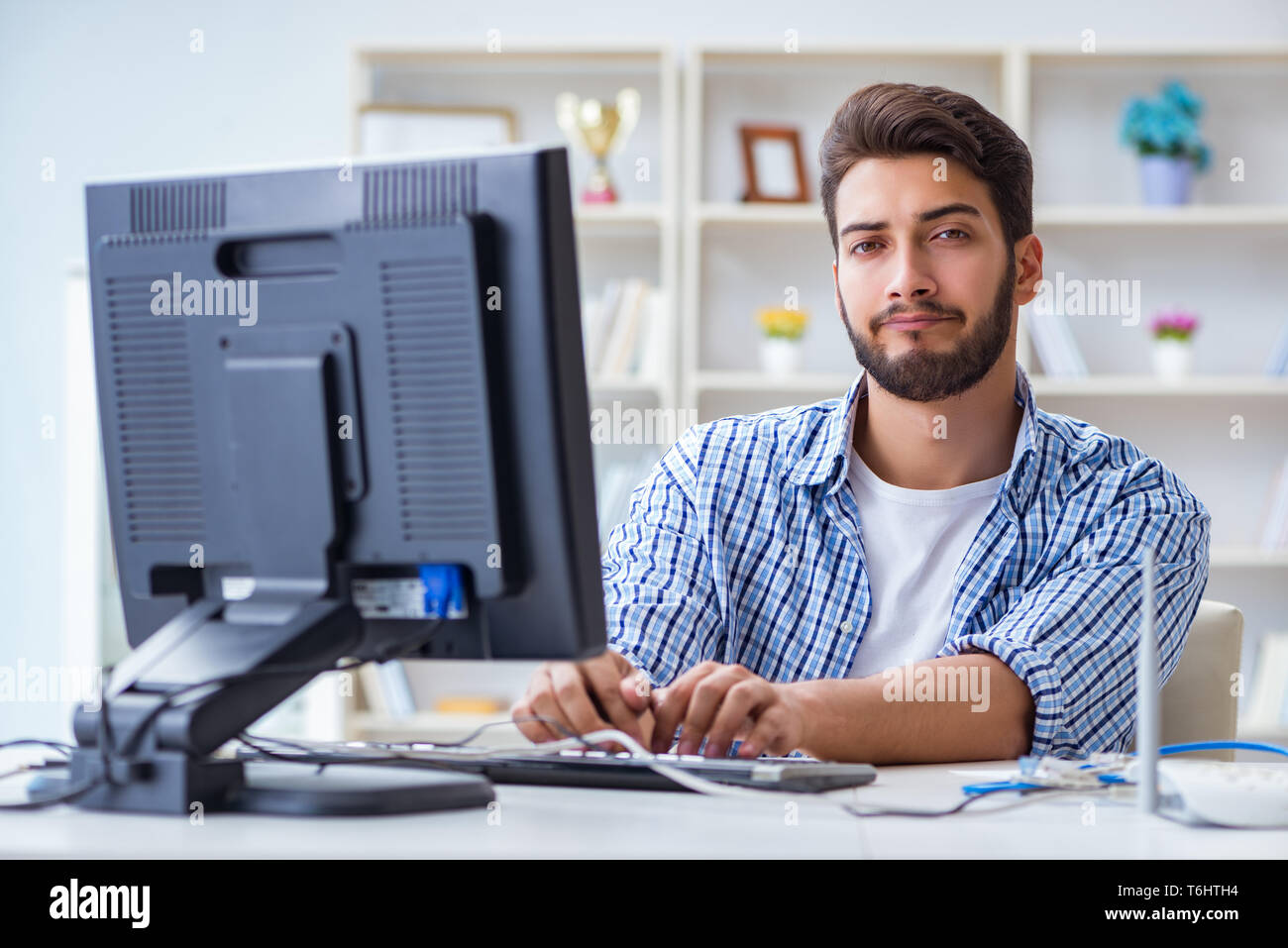 Frustrated young man due to weak internet reception Stock Photo - Alamy