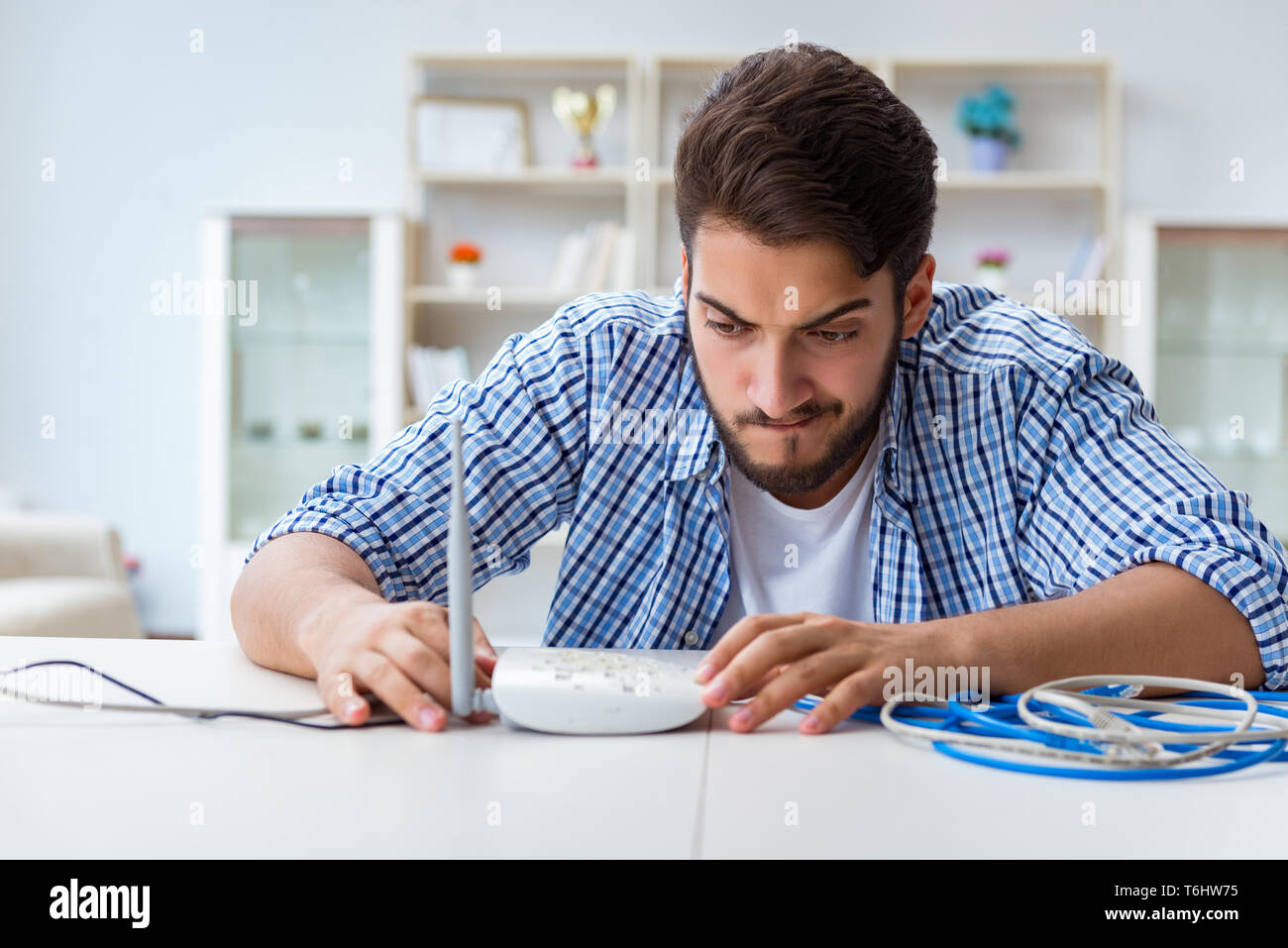 Frustrated young man due to weak internet reception Stock Photo - Alamy
