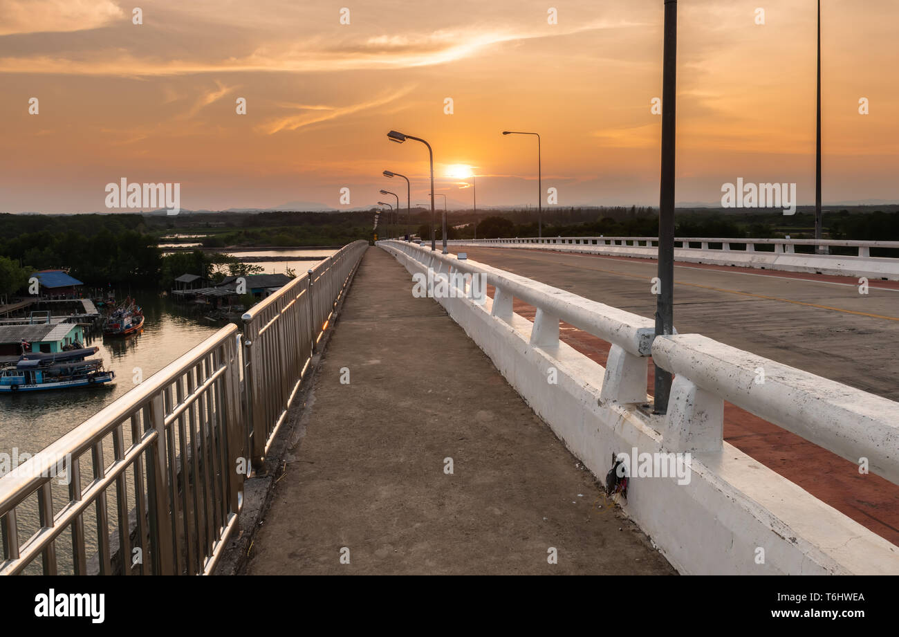 Cement Bridge roadside walkway with sunset warm color lighting time ...
