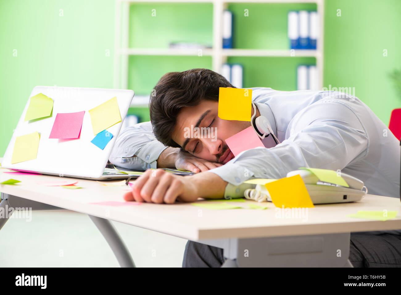 Young help desk operator working in office with many conflicting Stock ...