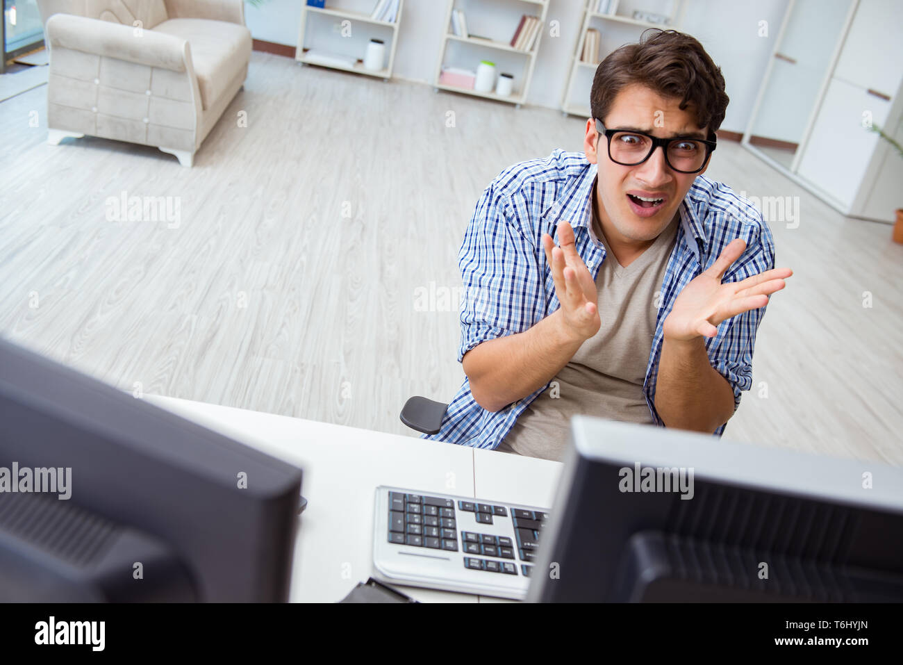 Young trader monitoring markets on screens Stock Photo - Alamy