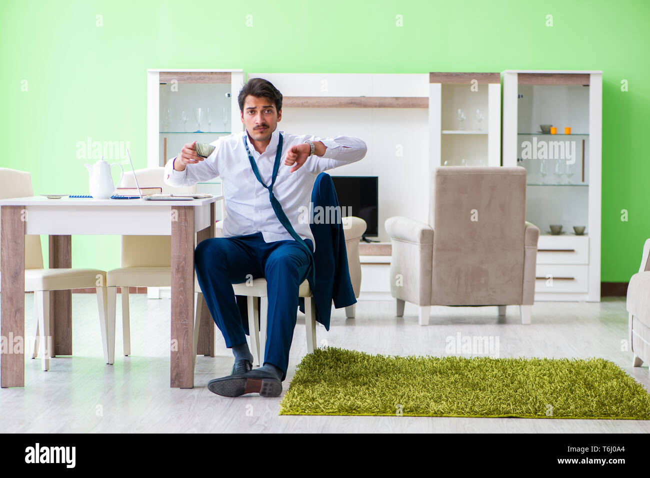 Man dressing up and late for work Stock Photo - Alamy