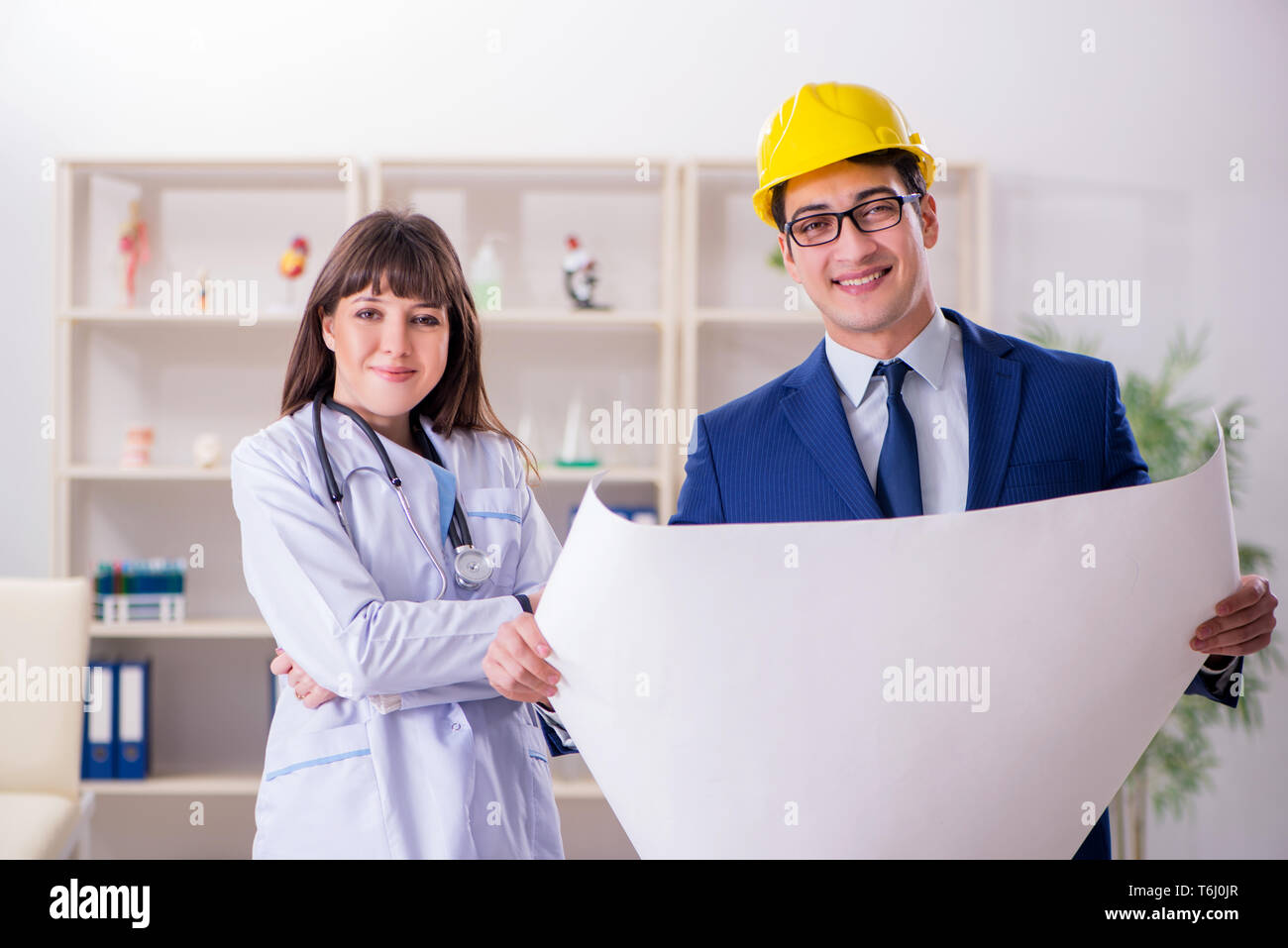Doctor discussing new hospital plan with architect Stock Photo - Alamy