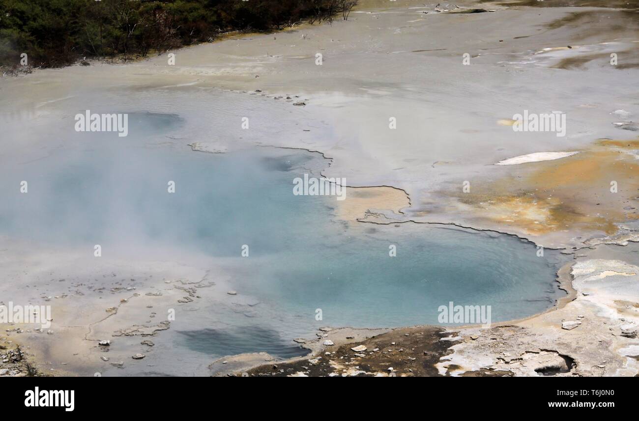 Orakei Korako hidden geothermal valley: View on steaming blue hot pool ...