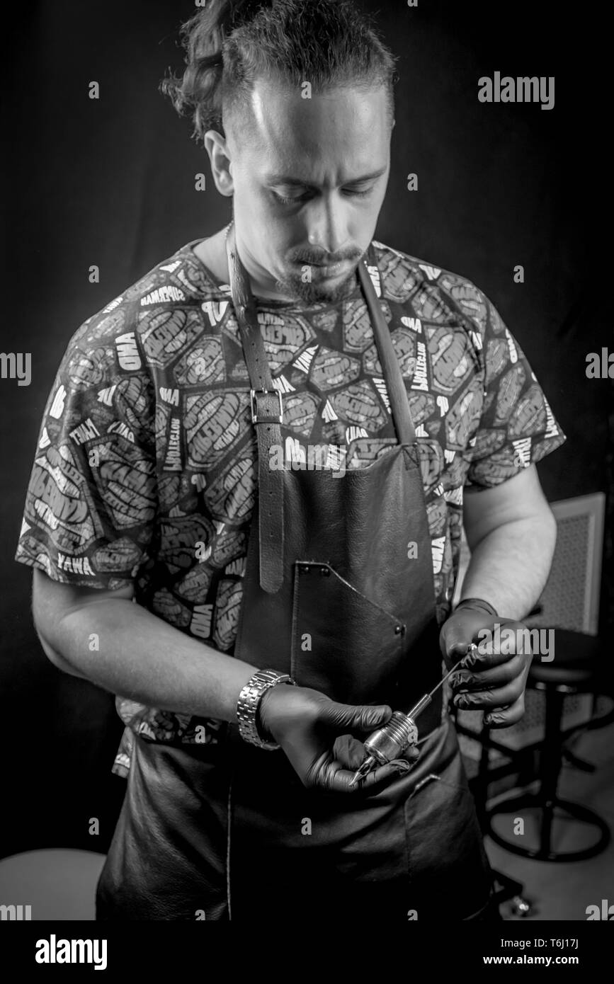Professional tattoo artist poses in tattoo studio Stock Photo - Alamy
